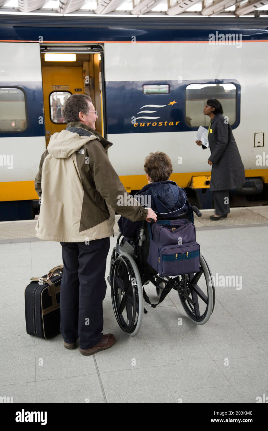 Wheelchair passenger waits to board a Eurostar train at Kings Cross ...