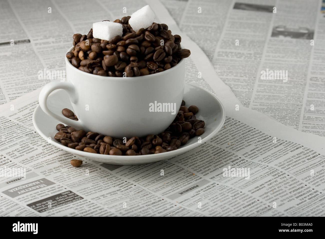 Coffee series with newspaper background Stock Photo - Alamy