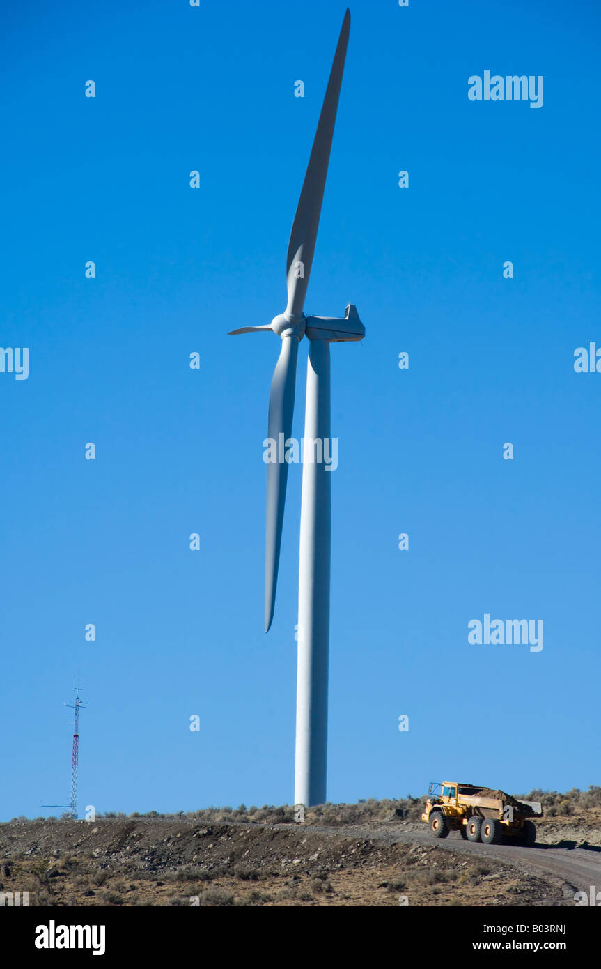Dump truck beneath wind turbines in the desert Stock Photo - Alamy