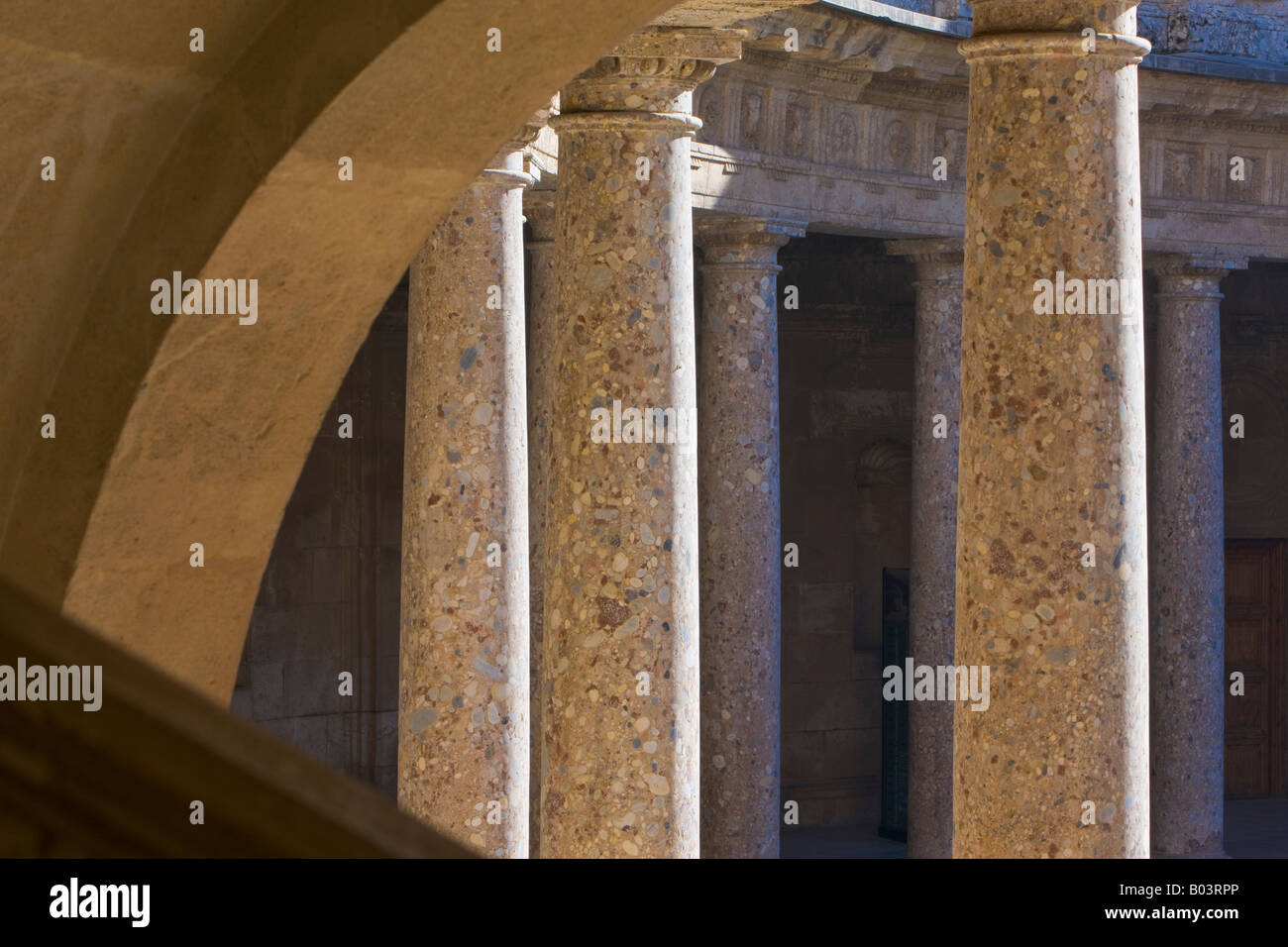 Columns in the circular courtyard of the Palace of Charles V (Palacio ...