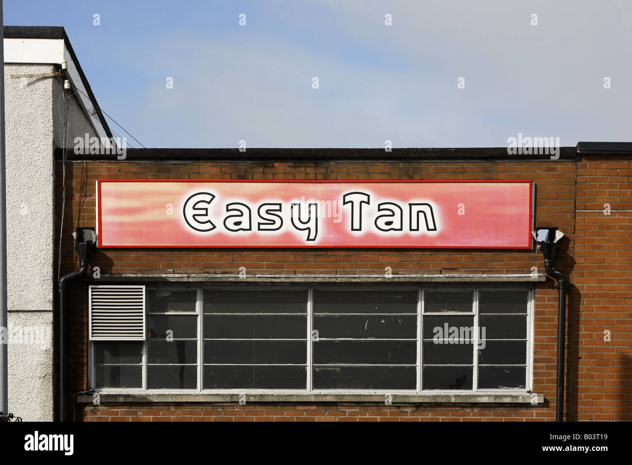 Easy Tan Sign Swansea Wales UK Stock Photo - Alamy