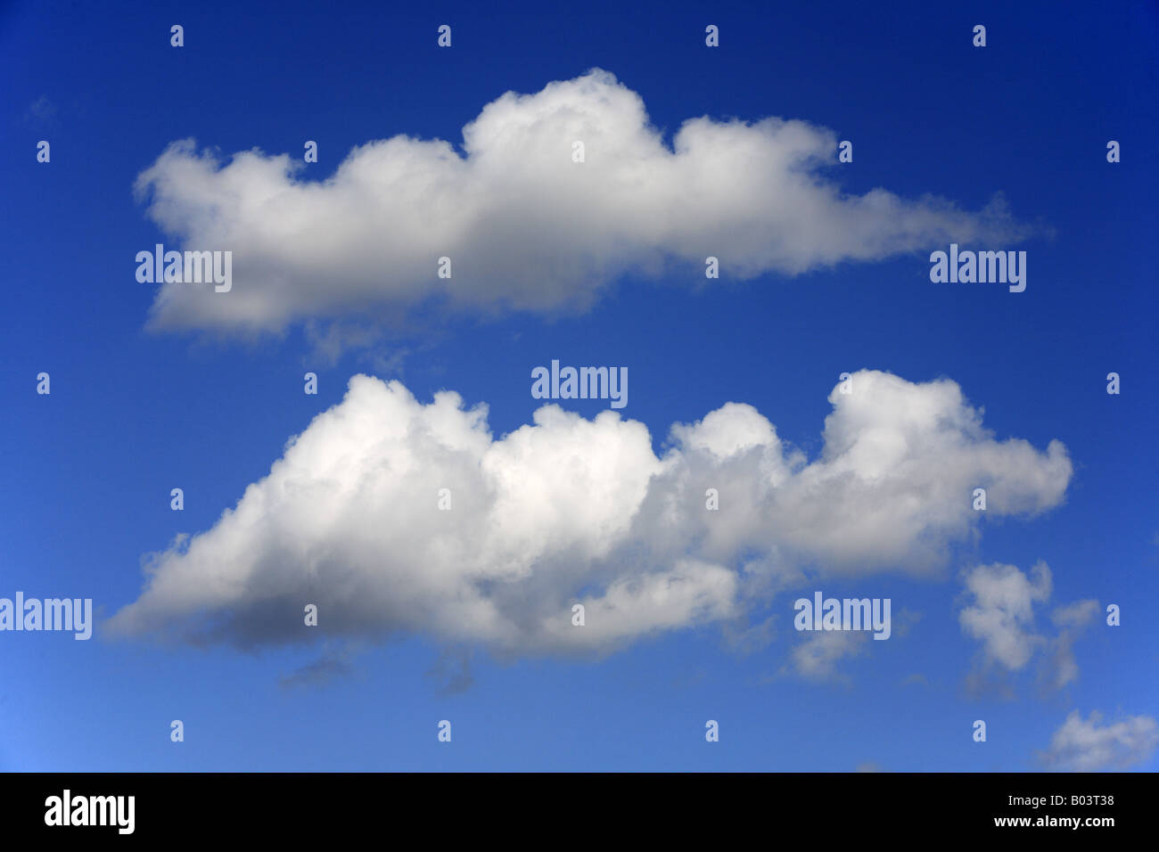 Two White Clouds Stock Photo - Alamy