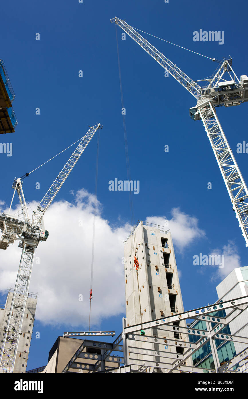 cranes on construction site Stock Photo - Alamy