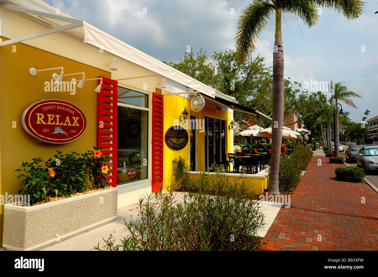 coffee bar restaurant shop with table chairs umbrella parasol in ...