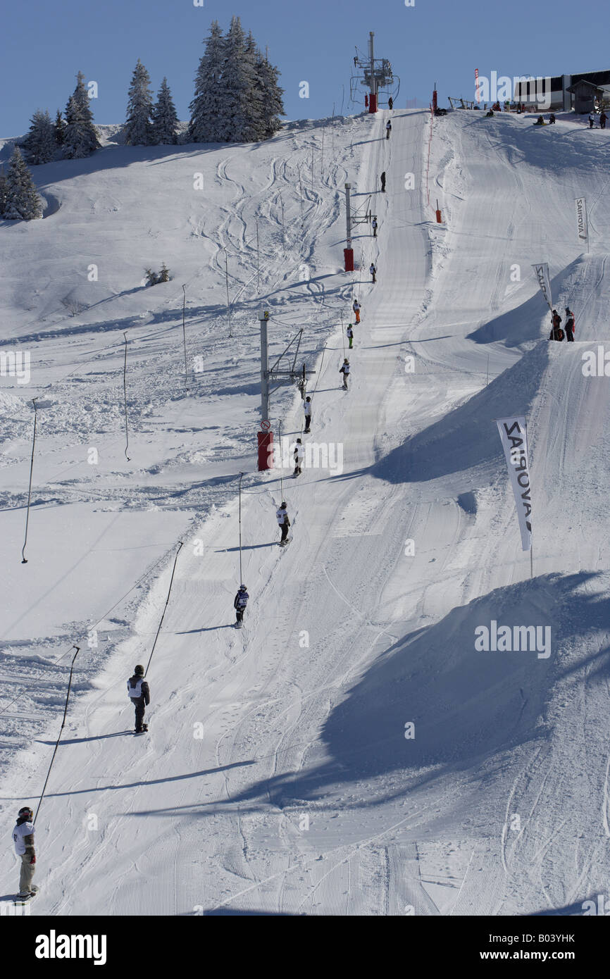 Skiers on a drag lift hi-res stock photography and images - Alamy