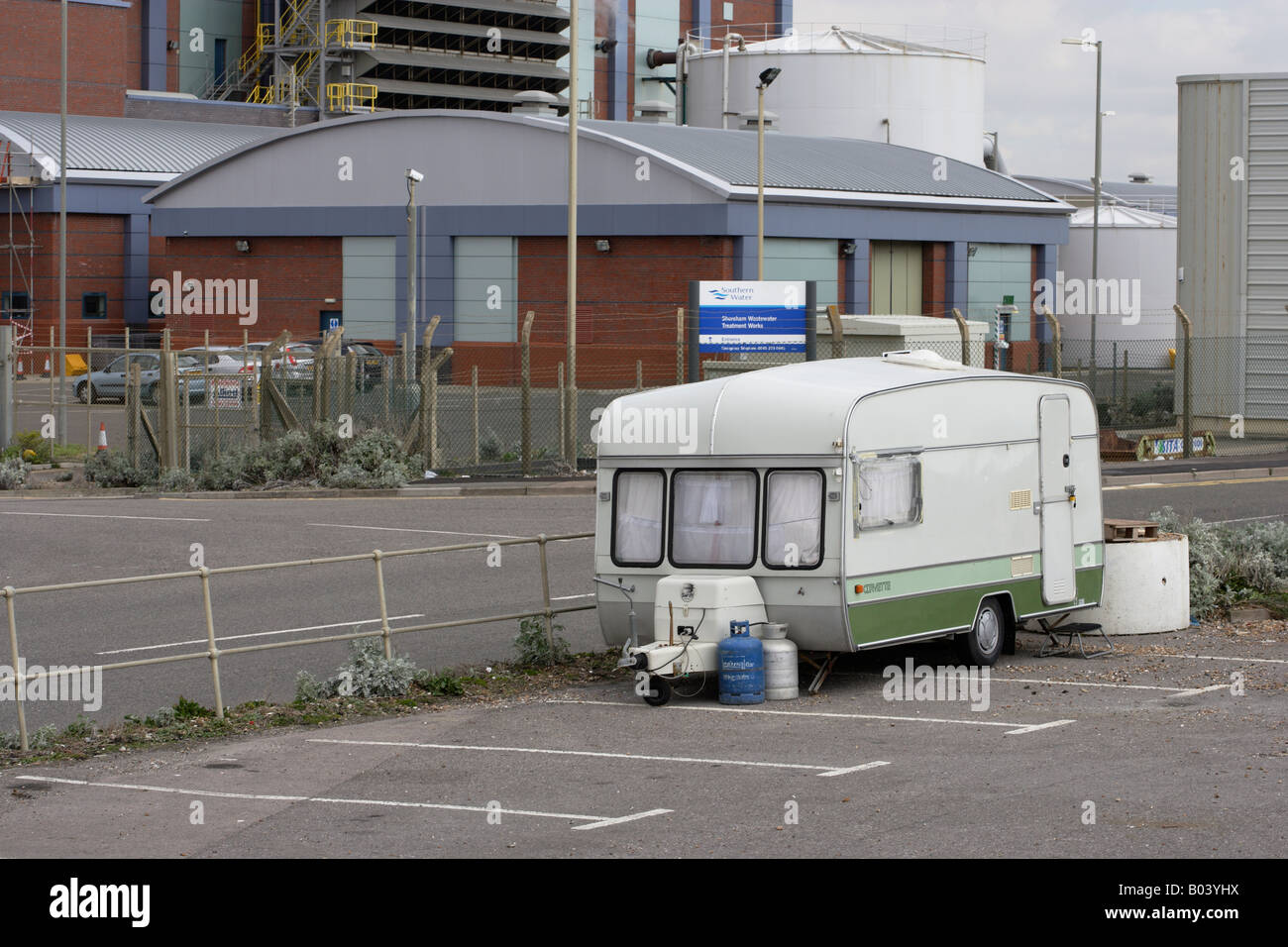 Caravan near industrial warehouses Stock Photo - Alamy