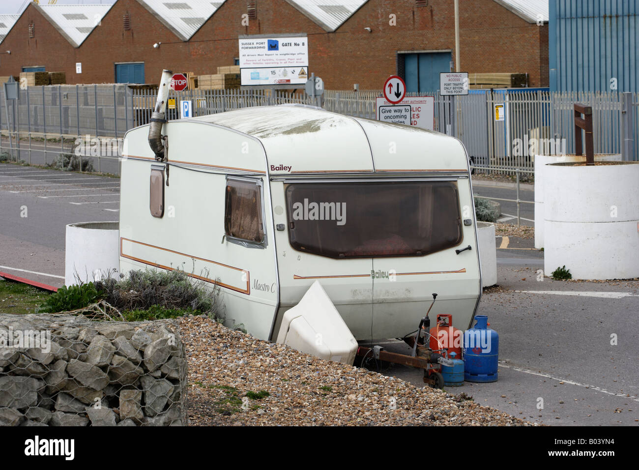 Caravan near industrial warehouses Stock Photo - Alamy