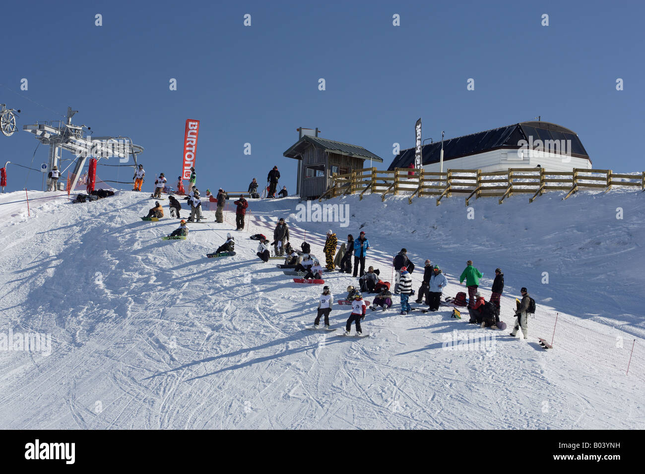 Snowboard jumping skills competition competitors Stock Photo - Alamy