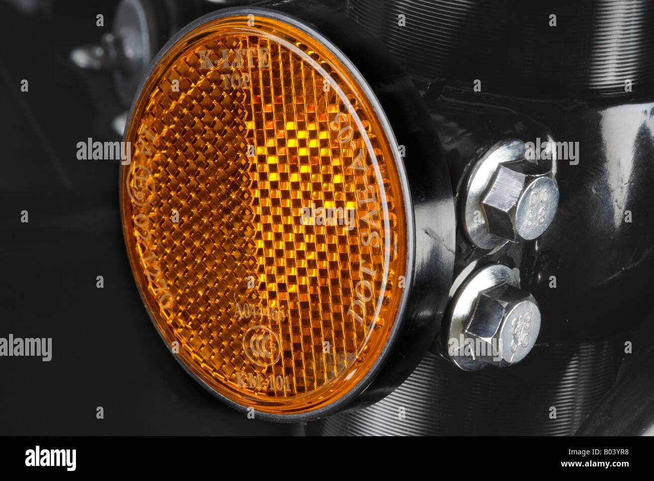 Orange reflector on a motorcycle Stock Photo - Alamy