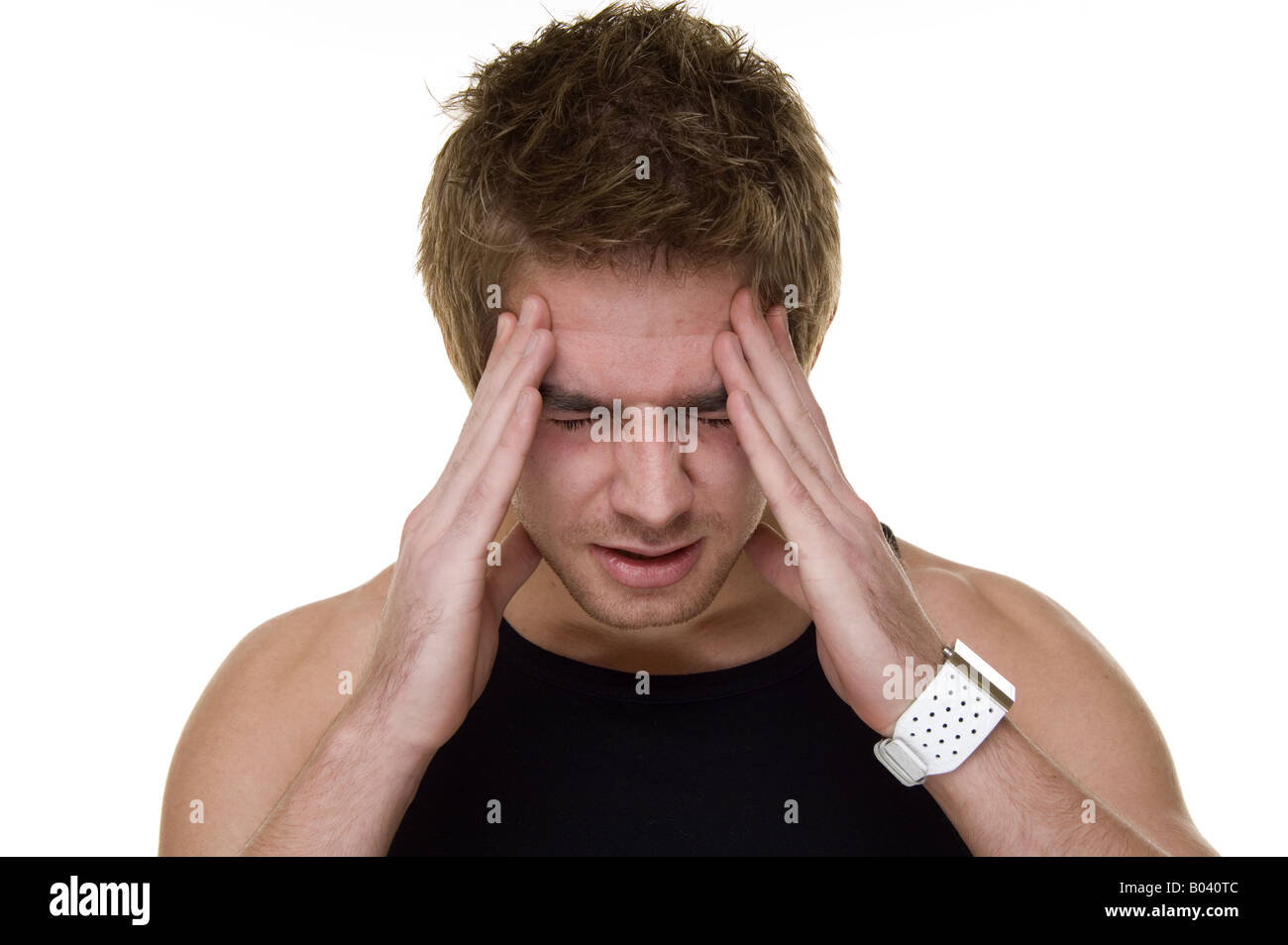 man holding his head in his hands in pain Stock Photo - Alamy