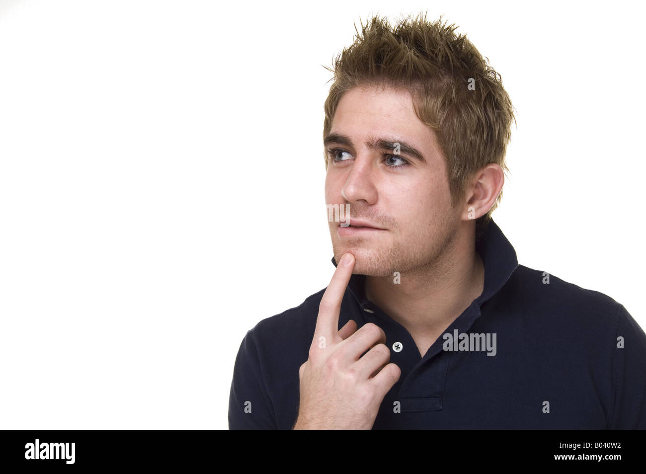 man with finger on his chin thinking Stock Photo - Alamy