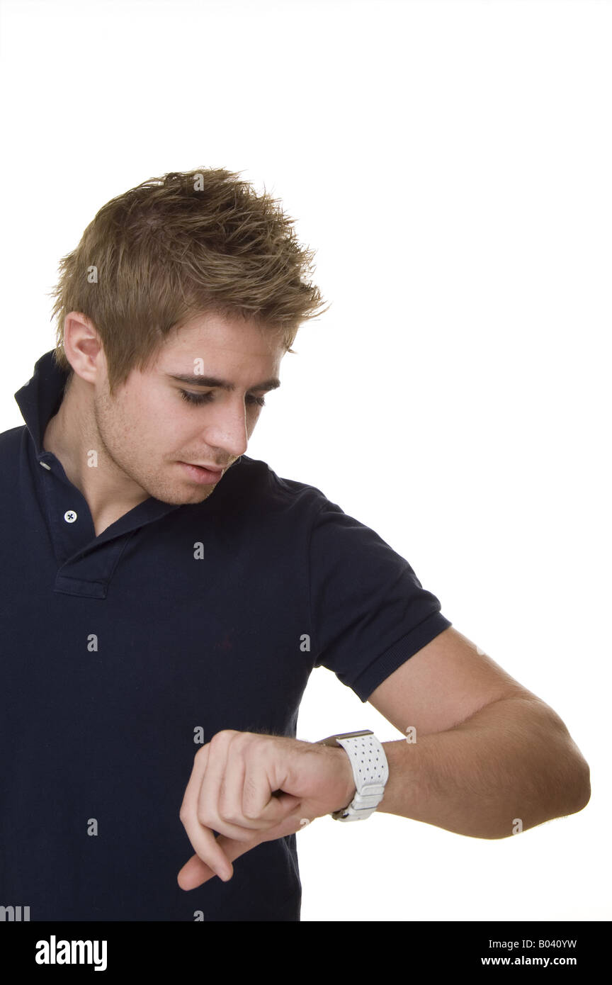 young man looking at time on his watch Stock Photo - Alamy