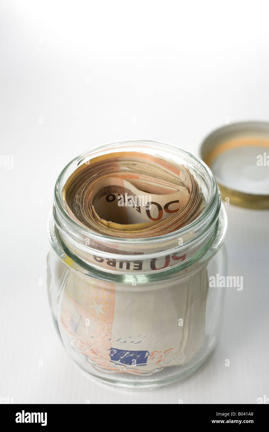 Home-savings: Euro banknote in the pot Stock Photo - Alamy