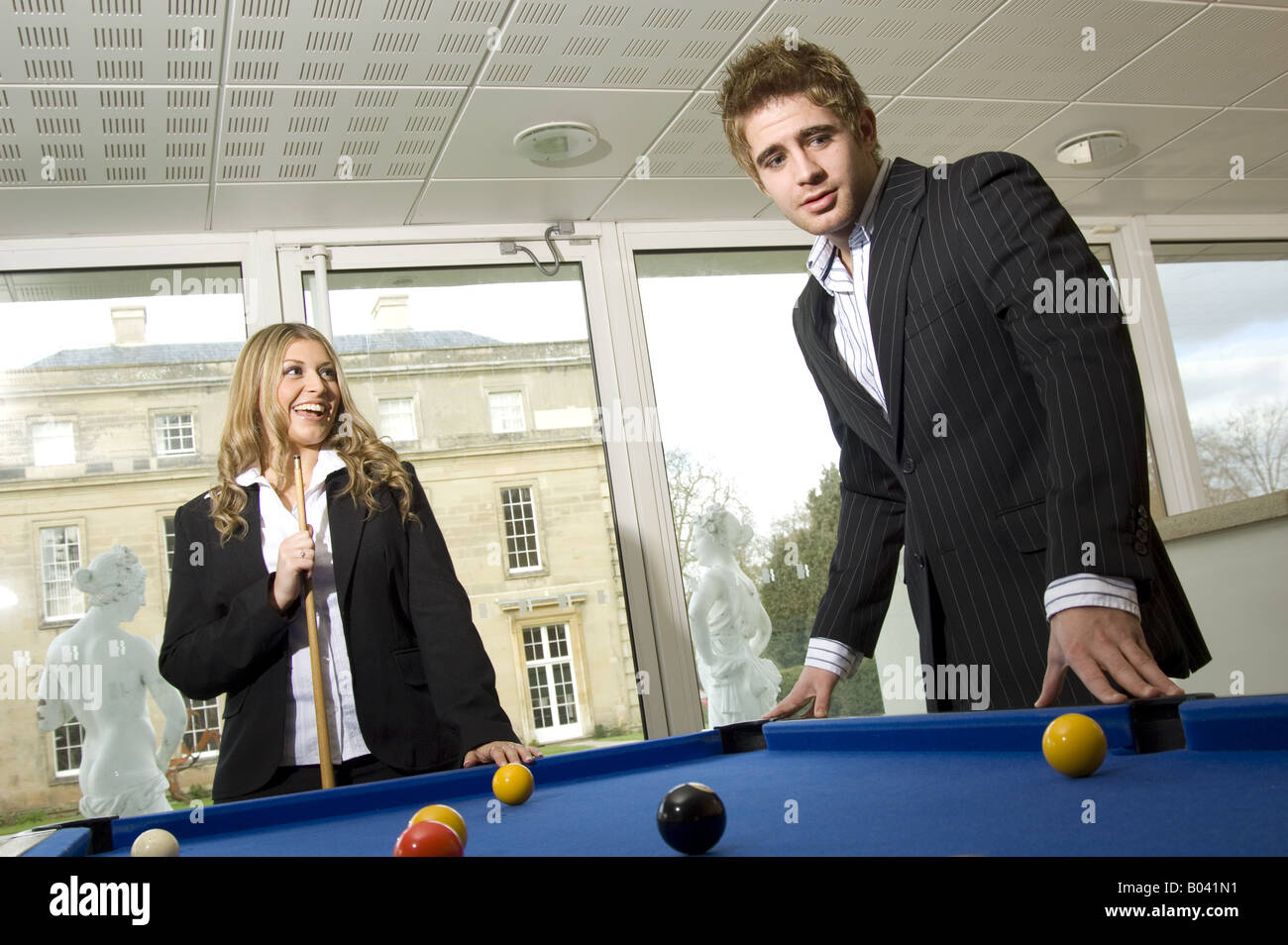 office workers playing pool on a break Stock Photo - Alamy