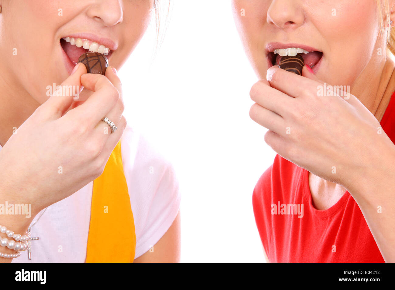 Young Women Eating Chocolates Model Released Stock Photo - Alamy