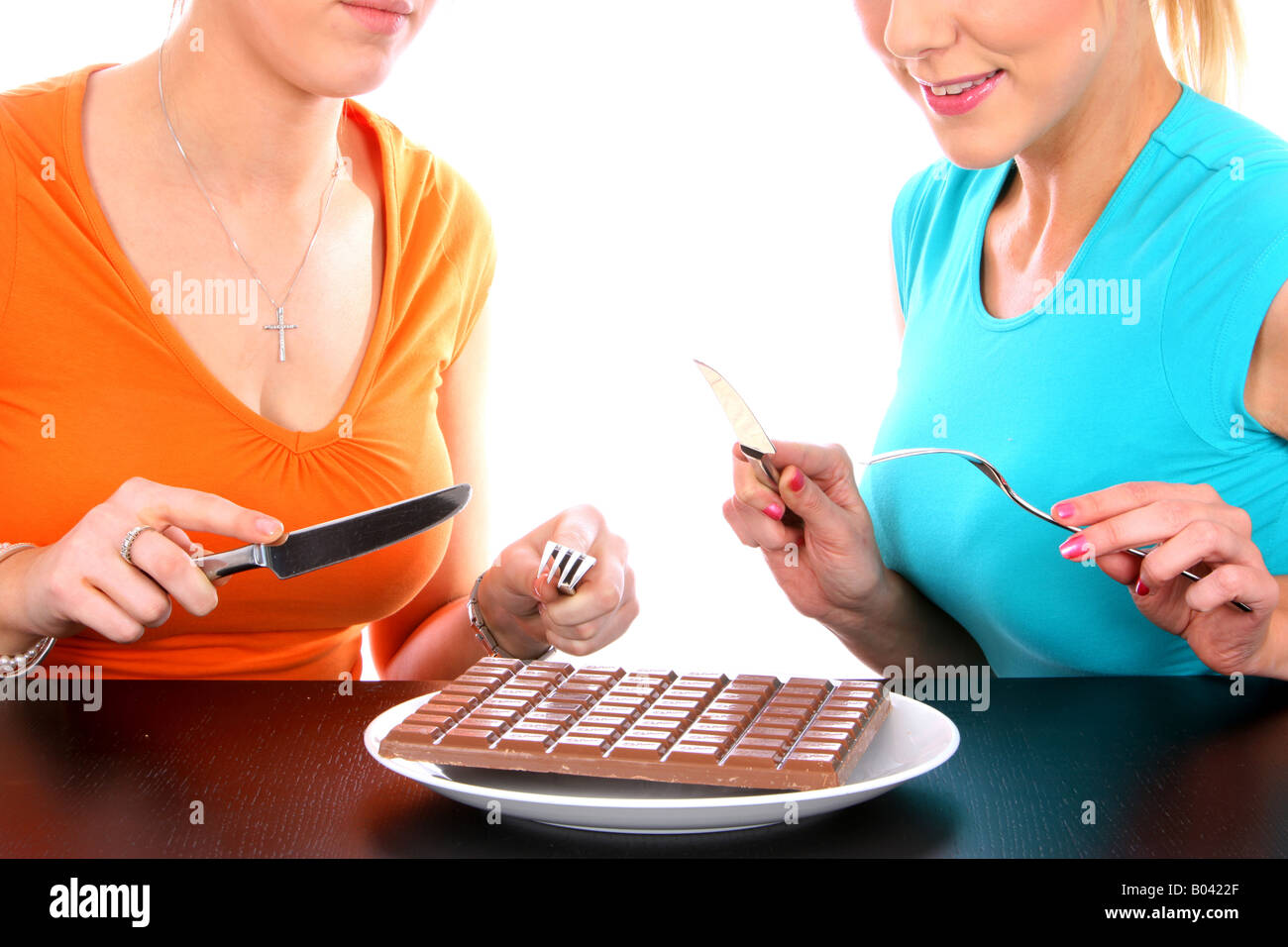 Young Women Eating Bar of Chocolate Model Released Stock Photo - Alamy