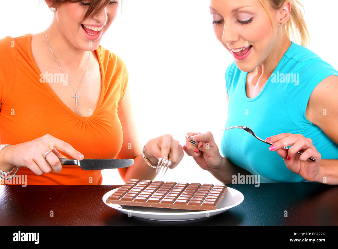 Young Women Eating Bar of Chocolate Model Released Stock Photo - Alamy
