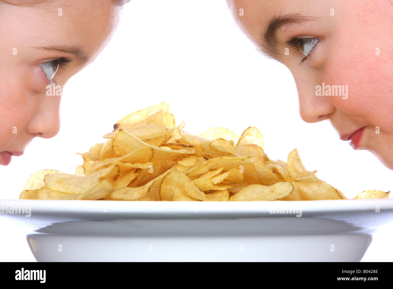 Children with Bowl of Crisps Models Released Stock Photo - Alamy