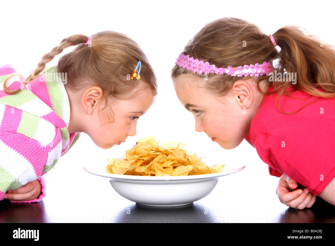Children with Bowl of Crisps Models Released Stock Photo - Alamy