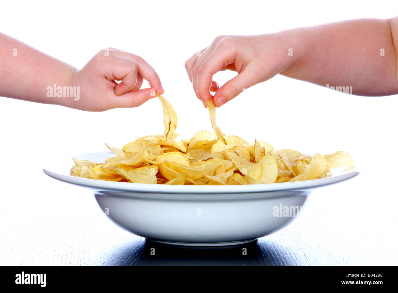 Children Grabbing Crisps Models Released Stock Photo - Alamy
