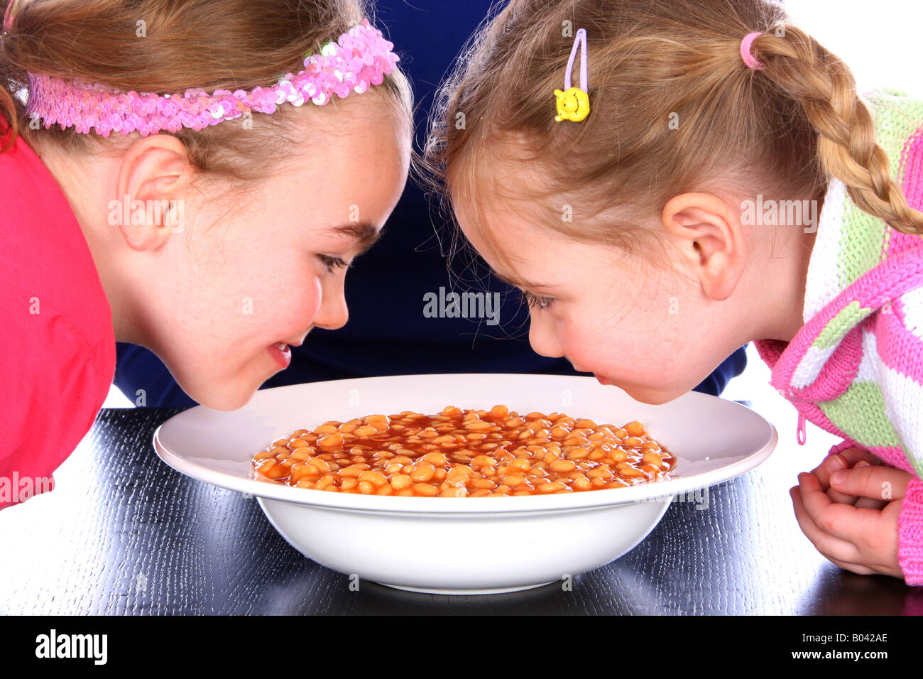 Children with Bowl of Baked Beans Models Released Stock Photo - Alamy