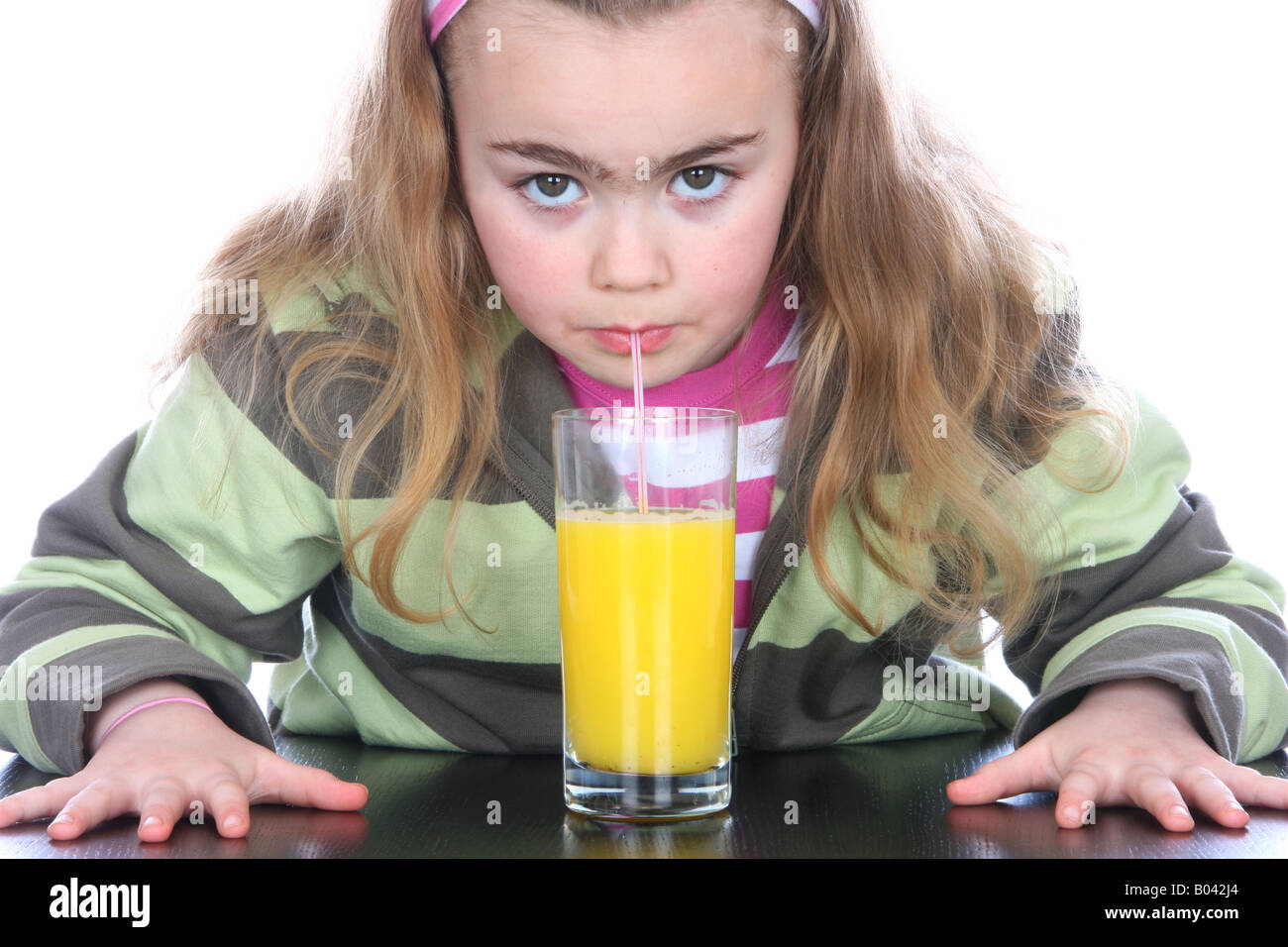 Young Girl Drinking Orange Juice Model Released Stock Photo - Alamy
