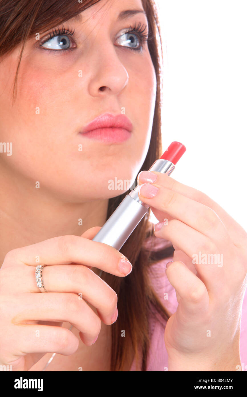 Young Woman Applying Lipstick Model Released Stock Photo - Alamy