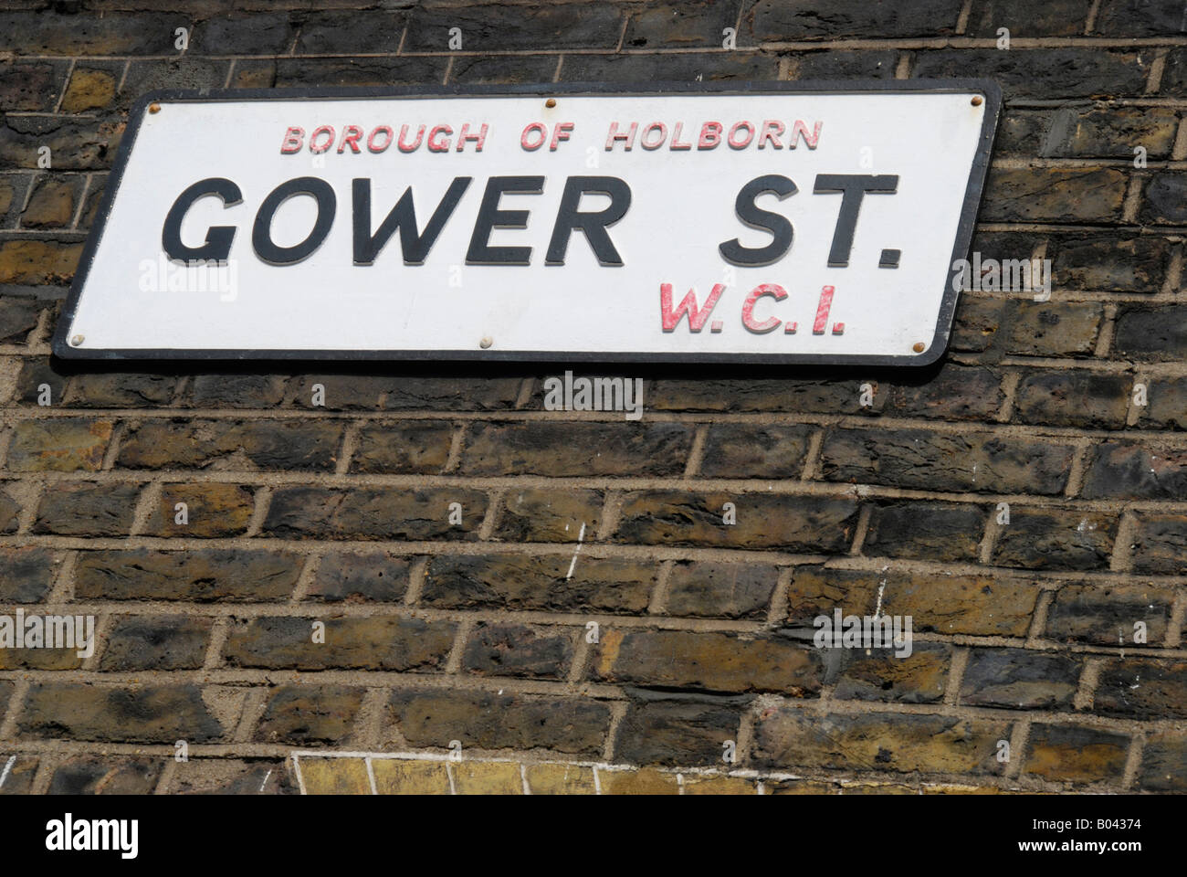 Old Borough of Holborn Gower Street sign on brick wall London England ...