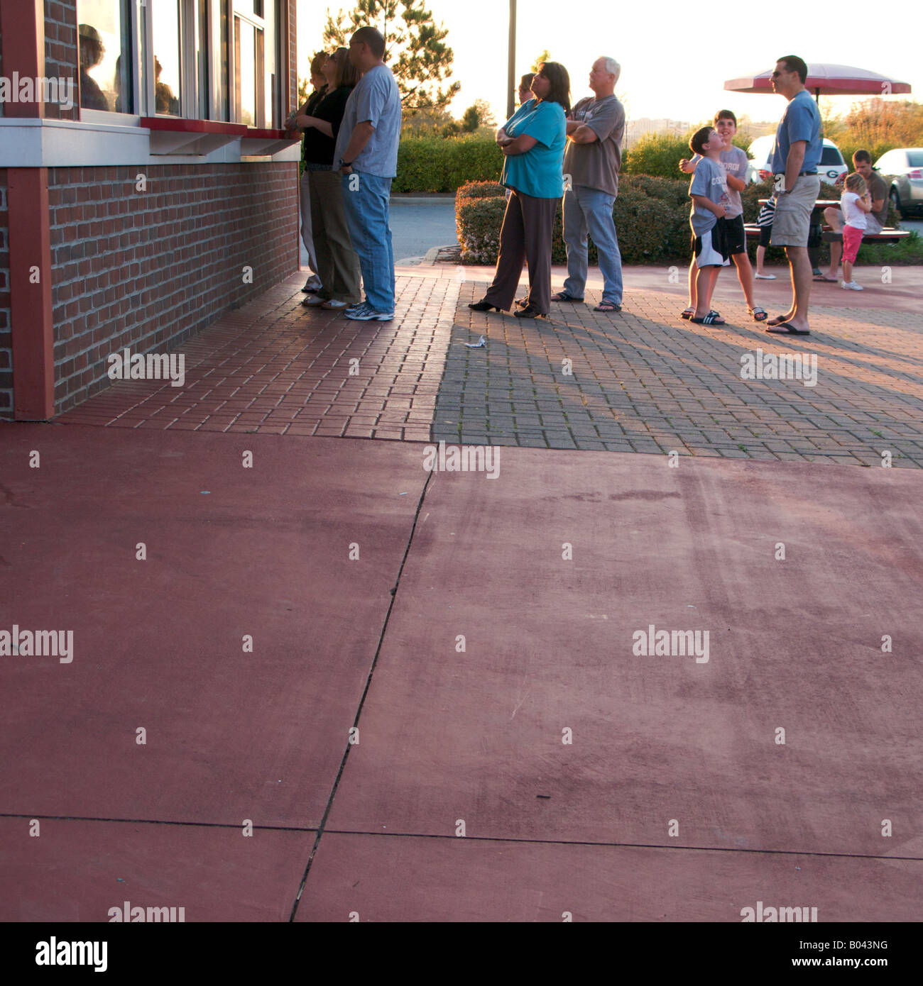 People waiting in line at ice cream shop Stock Photo - Alamy