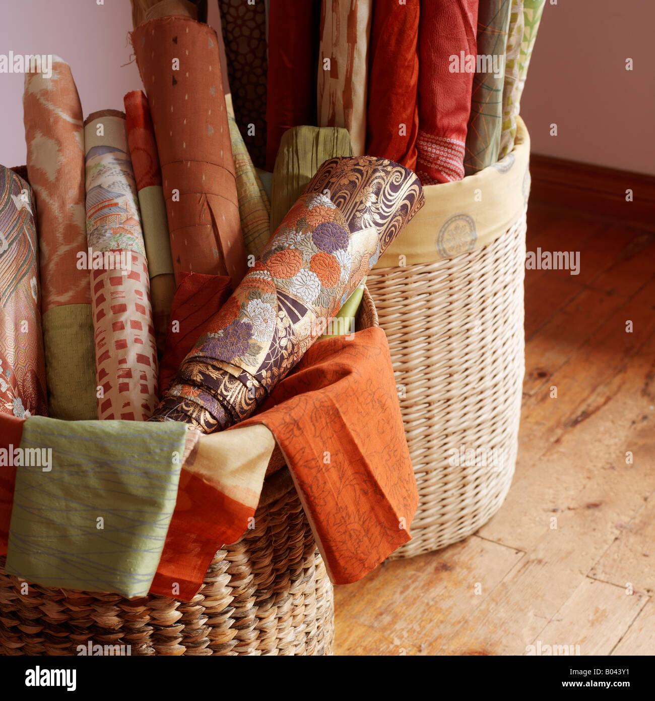 Rolls of Fabric in Baskets Stock Photo - Alamy