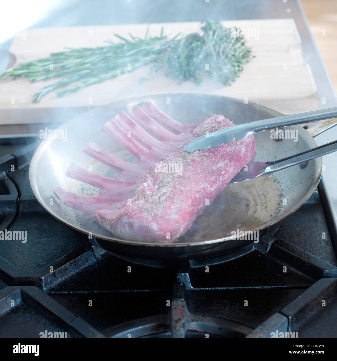 Cooking Meat in Frying Pan Stock Photo - Alamy