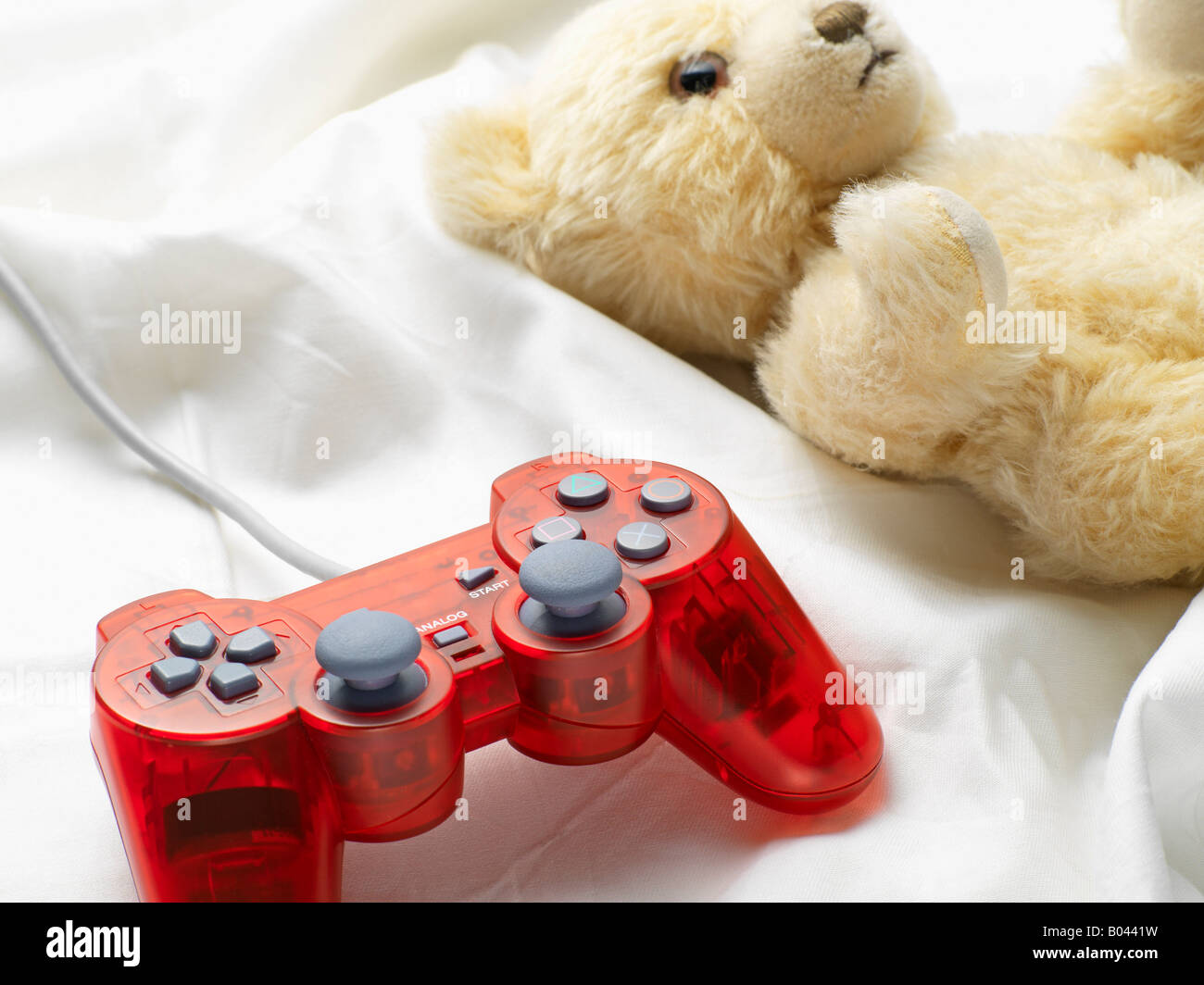 Video Game Controler and Teddy Bear Stock Photo - Alamy