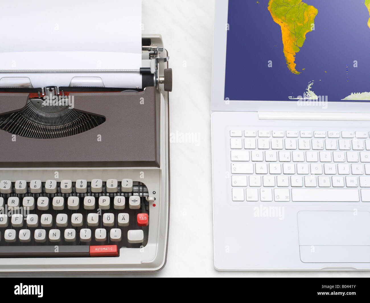 Laptop Computer and Typewriter Stock Photo - Alamy