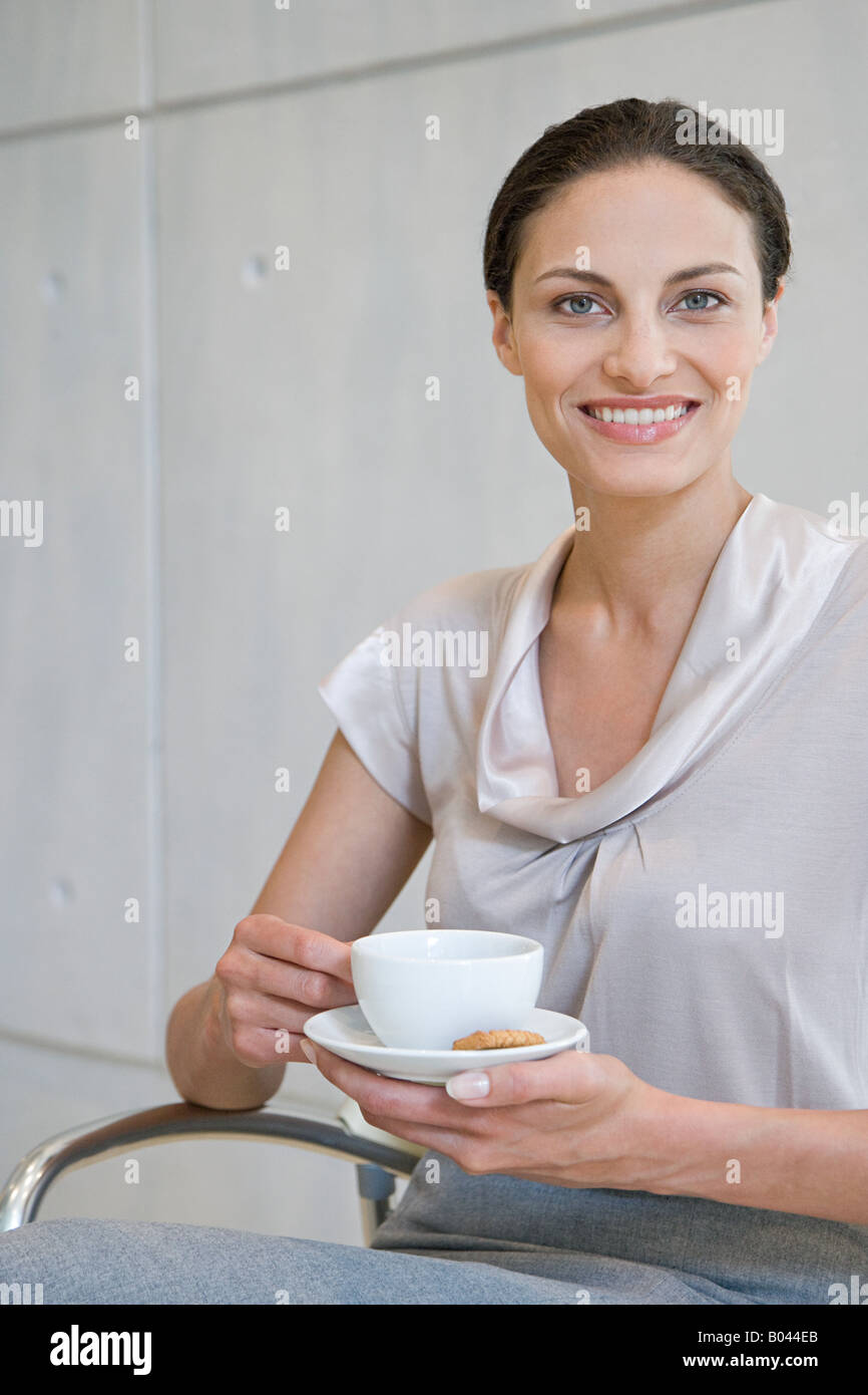 Woman having coffee Stock Photo - Alamy