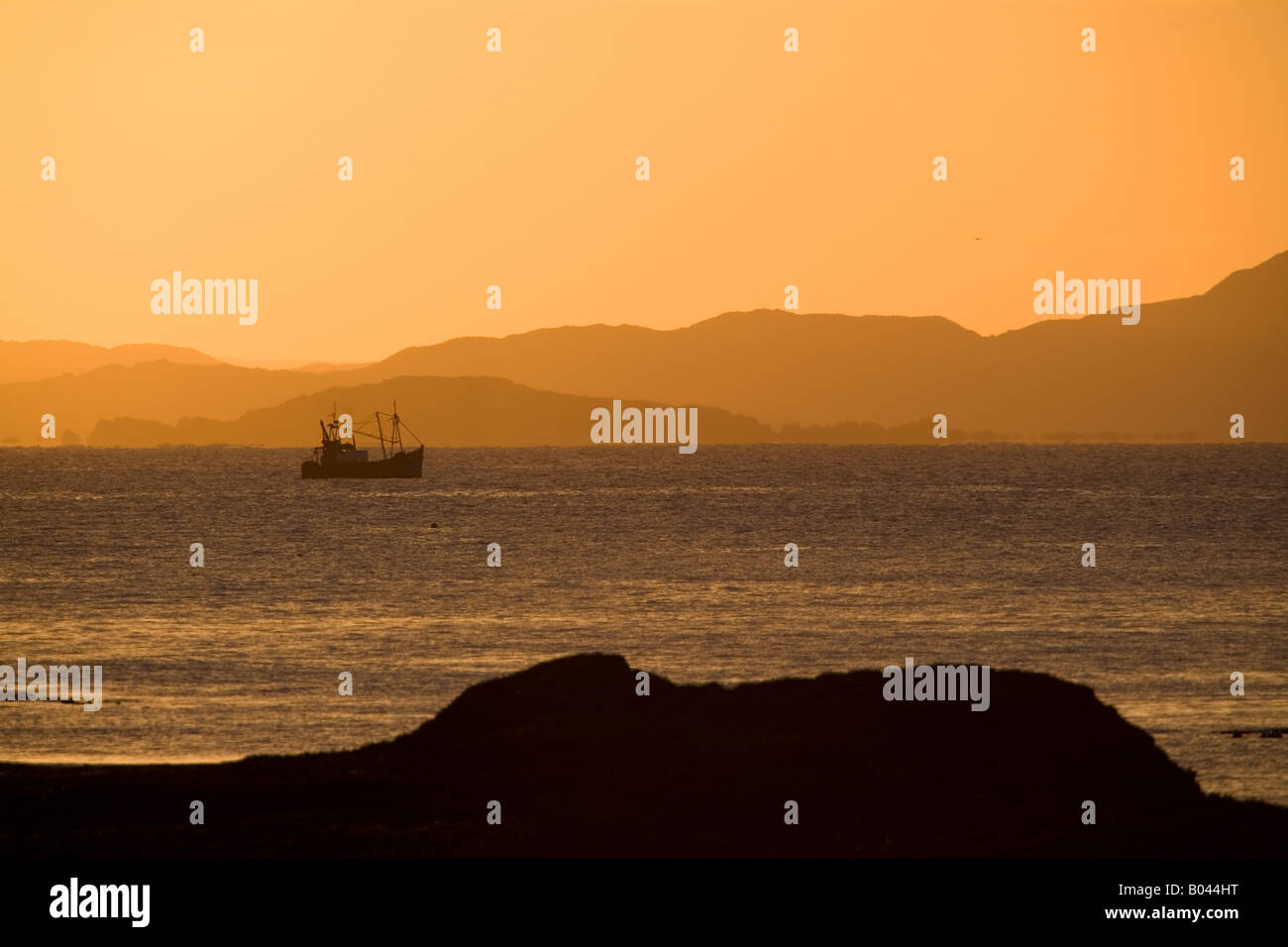 Fishing boat working, Carsaig Bay, Isle of Mull, Scotland Stock Photo ...