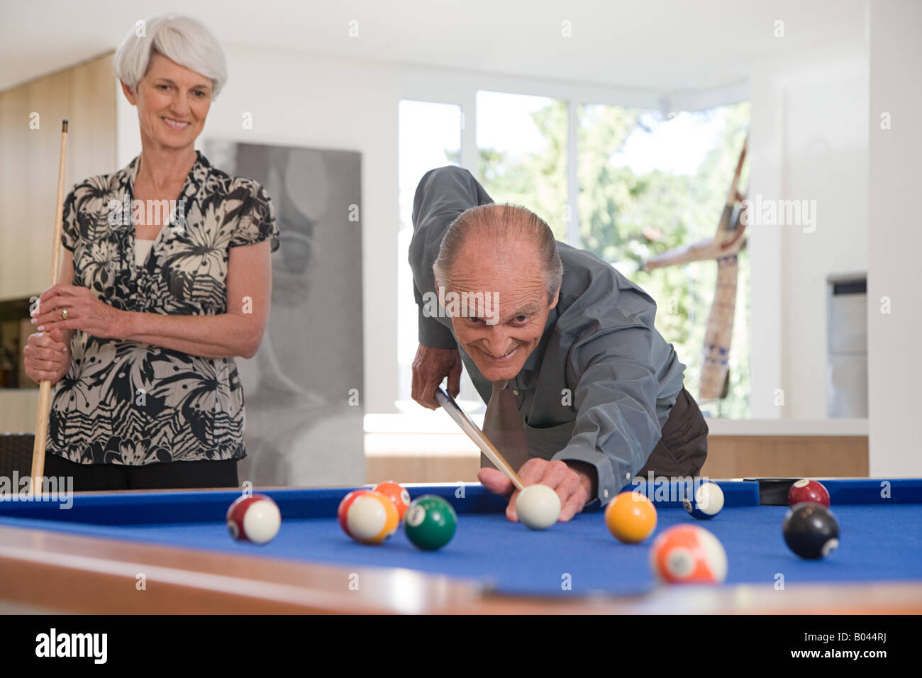 Couple playing by a pool hi-res stock photography and images - Alamy