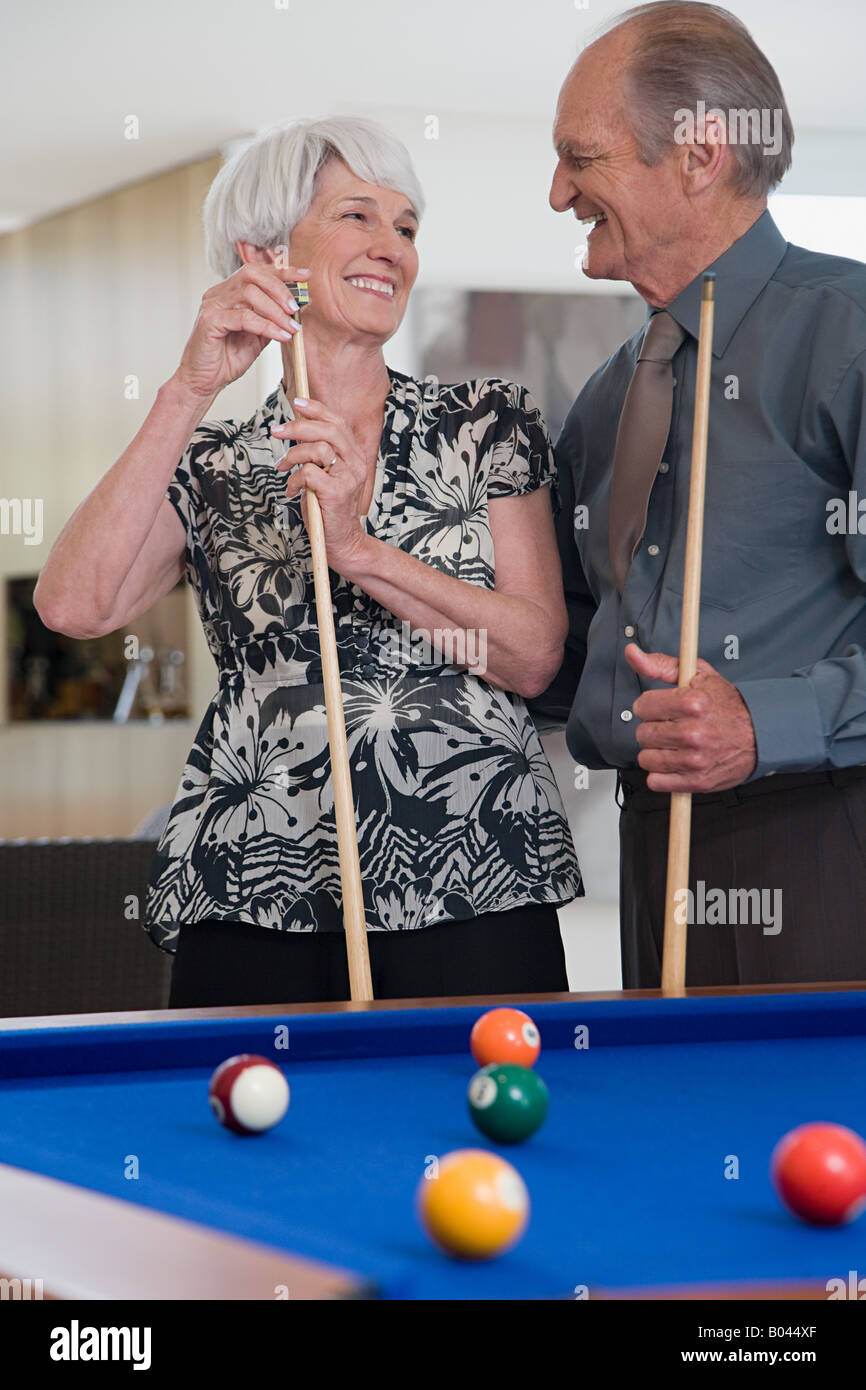 A senior couple playing pool Stock Photo - Alamy