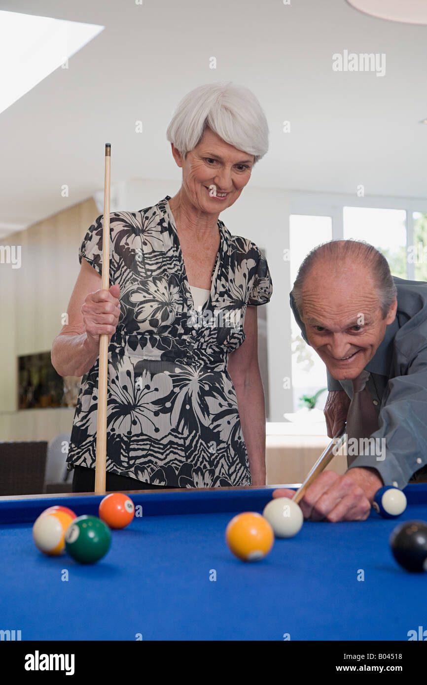 A senior couple playing pool Stock Photo - Alamy