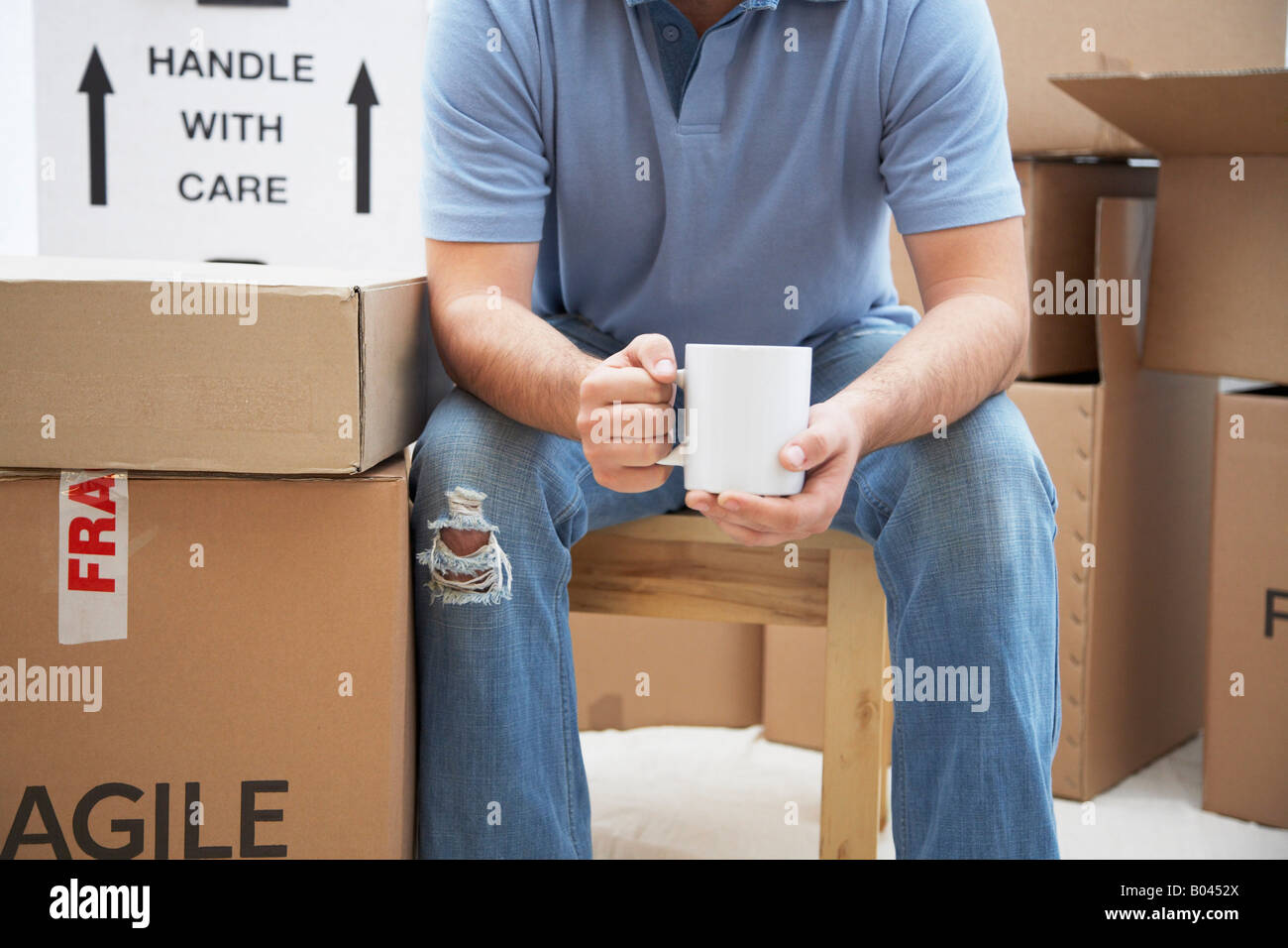 Sitting Man Sitting On Boxes High Resolution Stock Photography and ...