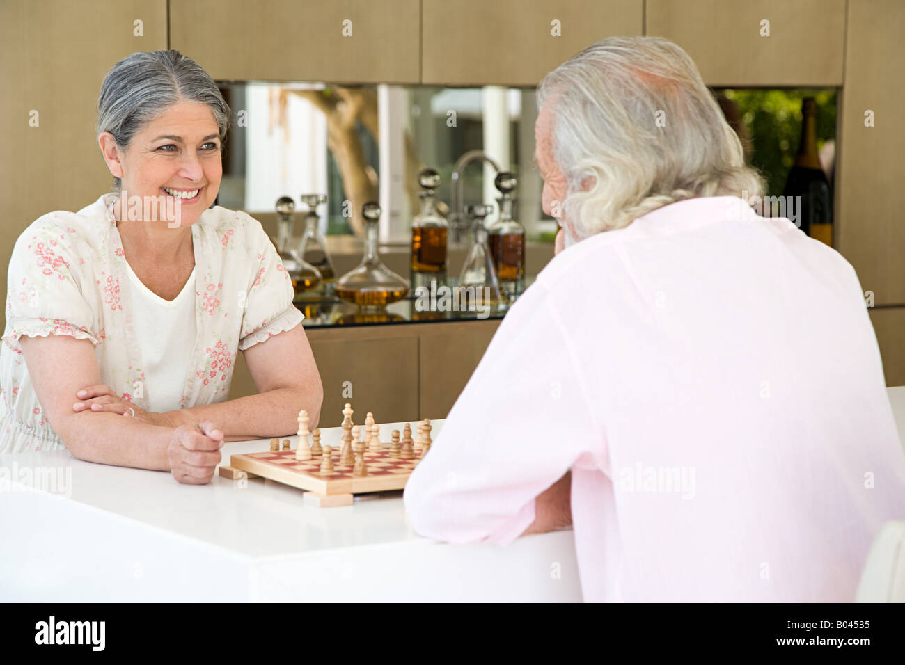 Senior couple playing board games hi-res stock photography and images ...