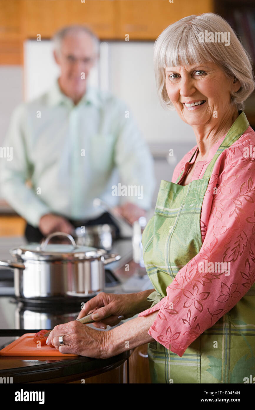 Senior woman cooking Stock Photo - Alamy