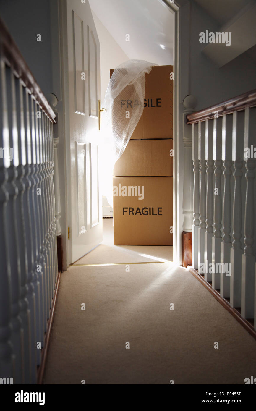 Boxes in Room of New Home Stock Photo - Alamy
