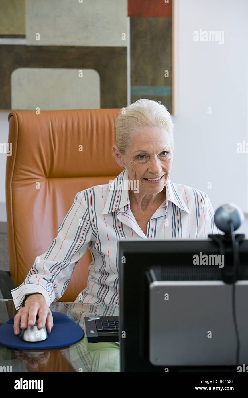 Senior woman using computer Stock Photo - Alamy