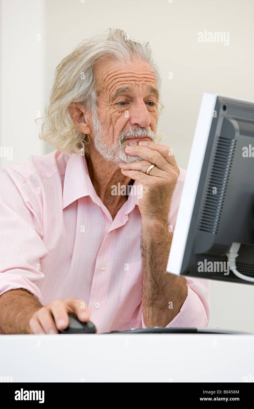 Senior man using computer Stock Photo - Alamy