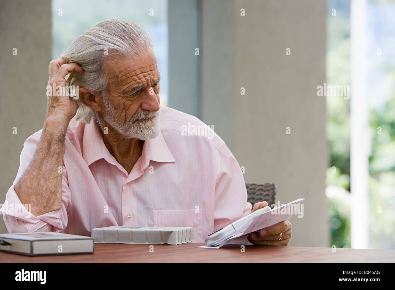 Man looking at object Stock Photo - Alamy