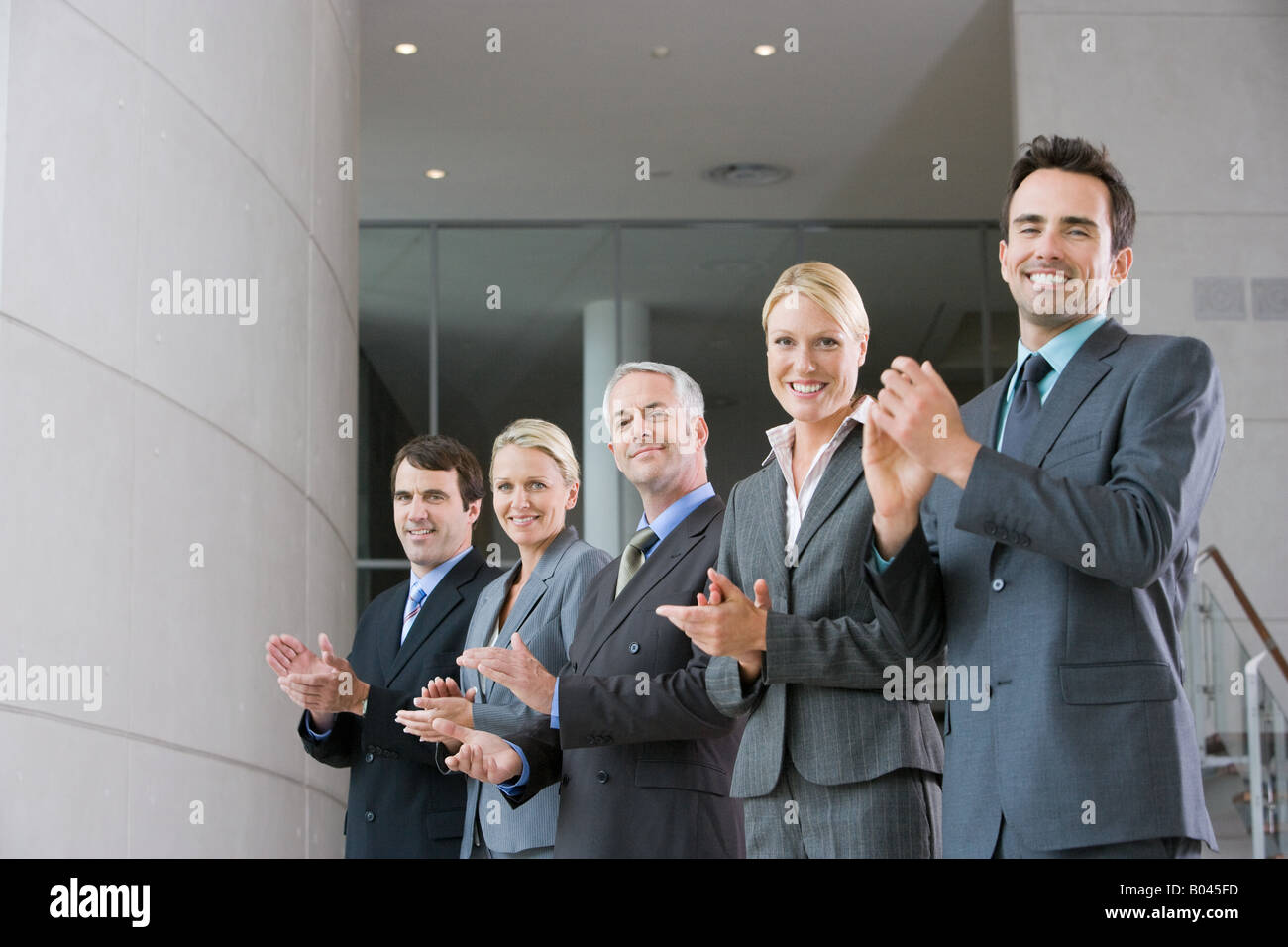 People clapping stand hi-res stock photography and images - Alamy