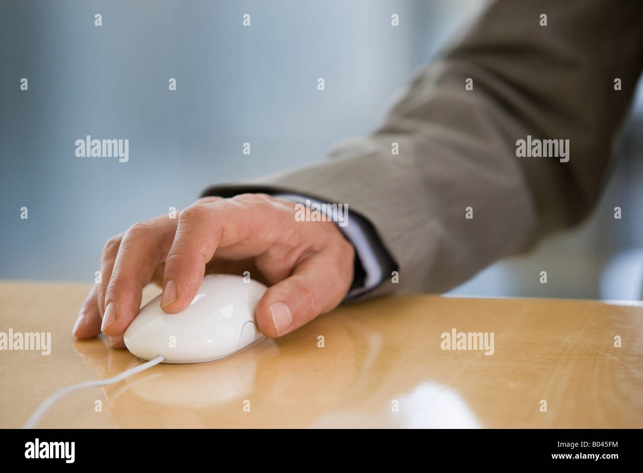 Businessman using a mouse Stock Photo - Alamy