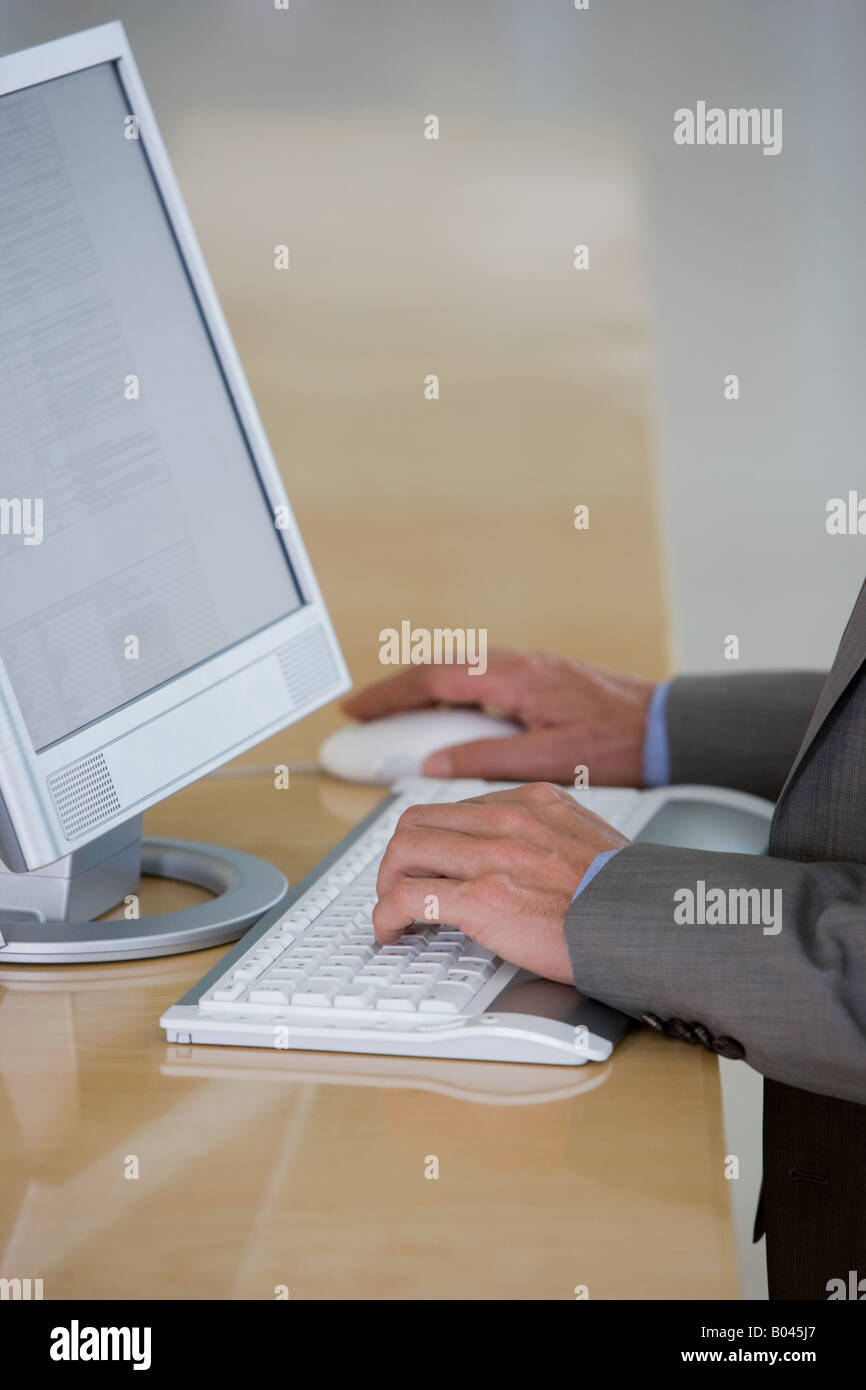 Businessman using computer Stock Photo - Alamy
