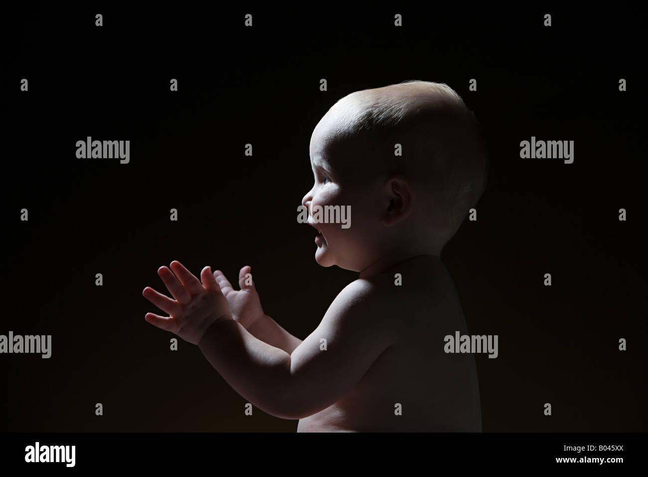 A baby boy clapping Stock Photo - Alamy