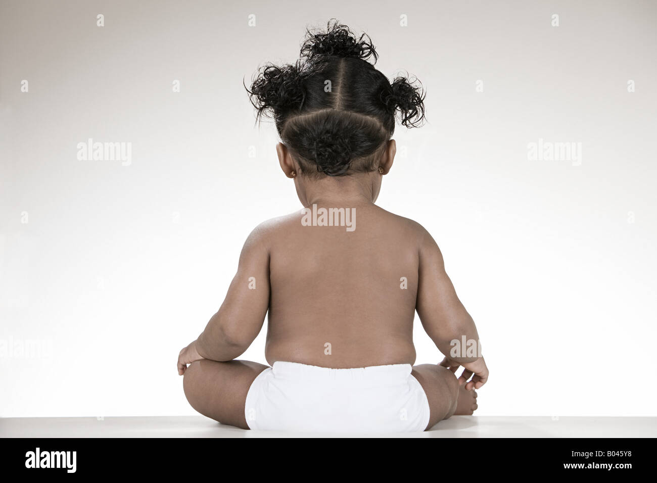 Rear view of a baby girl Stock Photo - Alamy